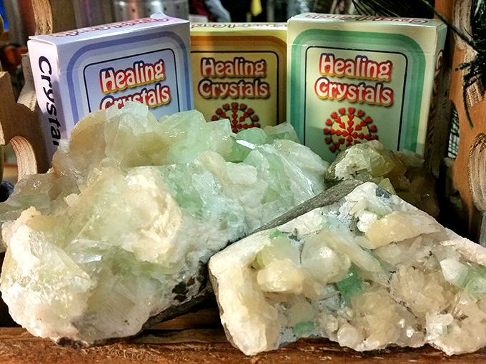 Healing crystals gleam under fluorescent lights, offering both geological beauty and metaphysical possibilities to the open-minded shopper.