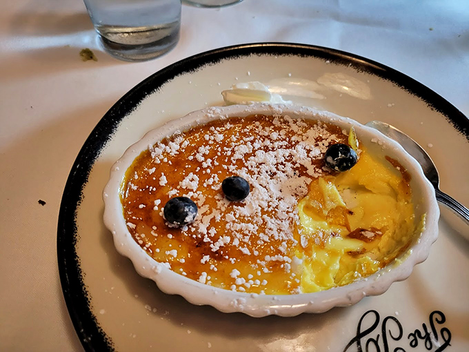 Cr&egrave;me br&ucirc;l&eacute;e with the perfect crackling top&mdash;like breaking into a sugar vault where custard gold awaits underneath.