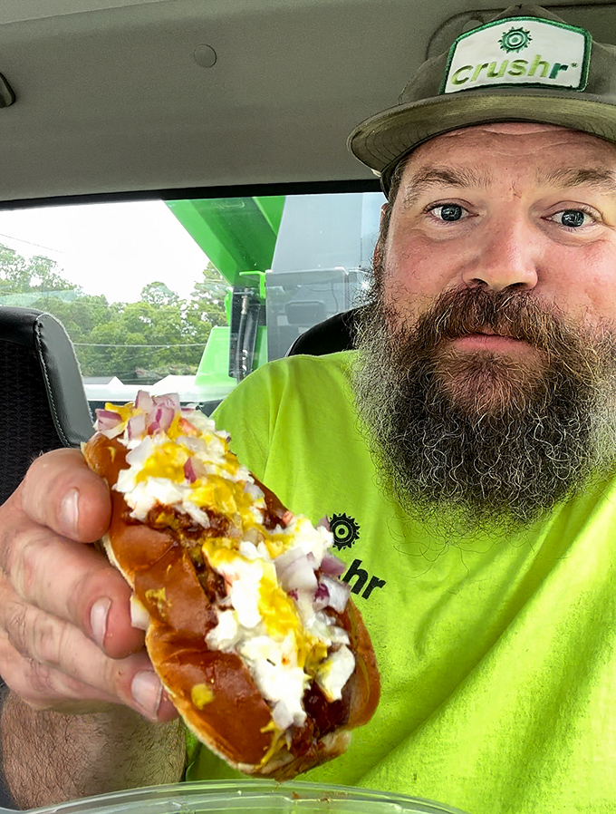 The face of pure burger satisfaction. When your food is so good you need to document the moment before taking another heavenly bite.