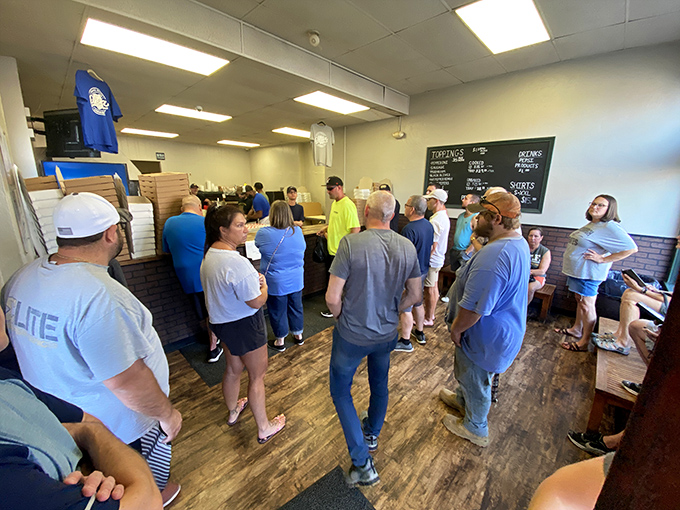 The line forms for a reason. These patient pizza pilgrims know that some things in life are absolutely worth waiting for.