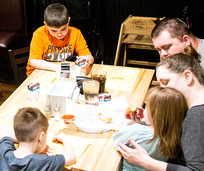 Family dinner done right. The table where memories are made between bites of pizza and where "can we get this again tomorrow?" is frequently asked.