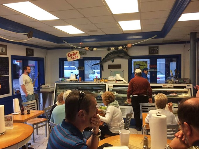 The true measure of a seafood joint: locals lining up at the counter, patiently waiting their turn for ocean-fresh treasures in Tennessee.