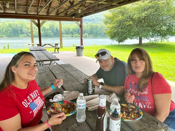 The true measure of great barbecue: people willing to eat outdoors with plastic utensils, grinning like they've discovered buried treasure.