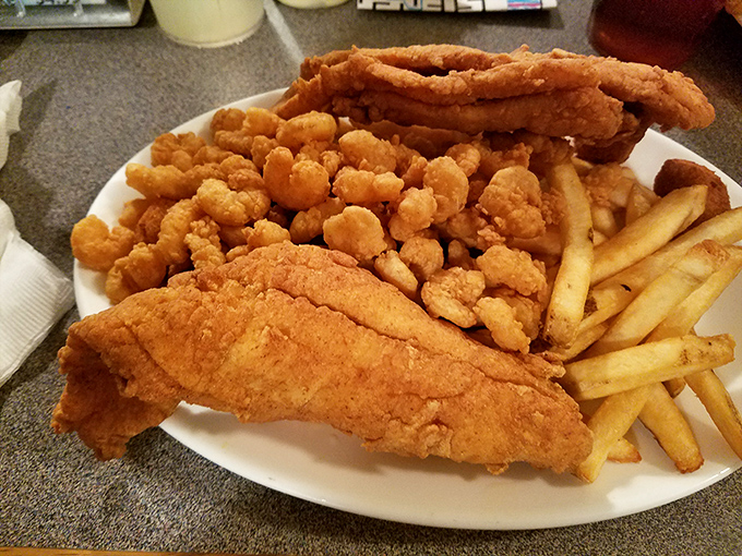 A platter that answers the eternal question: "Why choose one fried delight when you can have them all?" The seafood equivalent of a greatest hits album.