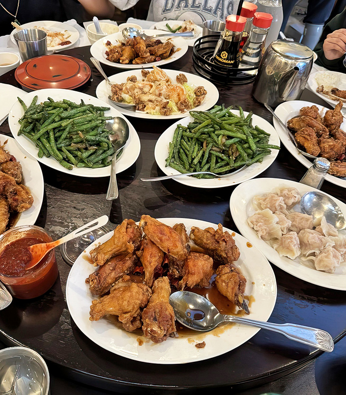 A table laden with multiple dishes – the proper way to experience San Tung, like assembling your own flavor Avengers team.