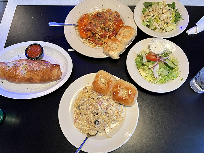 A feast fit for sharing &ndash; stromboli, pasta, and salads spread across the table like an Italian family reunion.