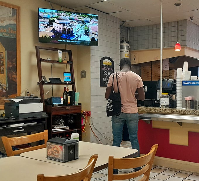 The counter where decisions are made, friendships are formed, and the staff knows whether you're an "extra sauce" or "extra cheese" kind of regular.