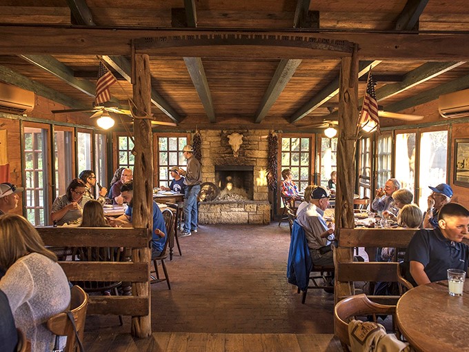 The dining room hums with conversation and satisfaction. Stone fireplace, wooden beams, and not a cell phone in sight&mdash;just people enjoying food together.