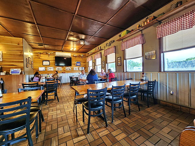 Morning conversations flow as easily as the coffee here, where regulars and newcomers share tables and stories under the warm ceiling glow. 