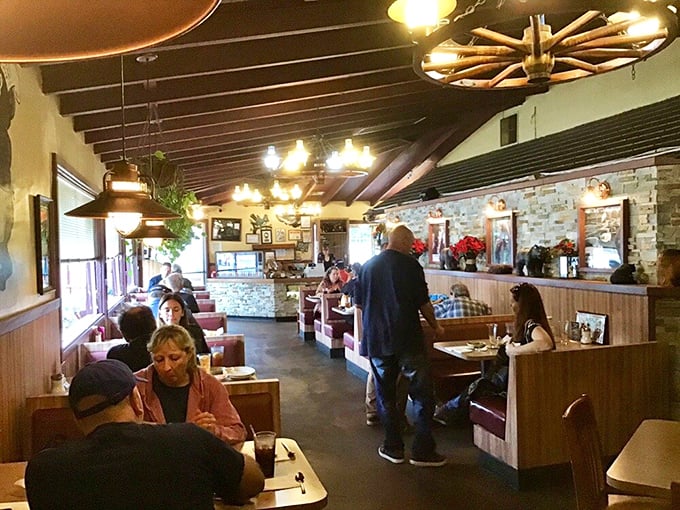 The dining room buzzes with conversation and the clinking of utensils. BBQ has a way of bringing strangers together.