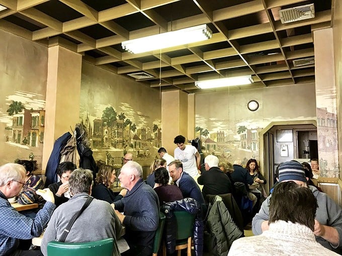 The dining room hums with the symphony of New York: conversations overlap, coffee cups clink, and everyone is united in pursuit of the perfect bite.