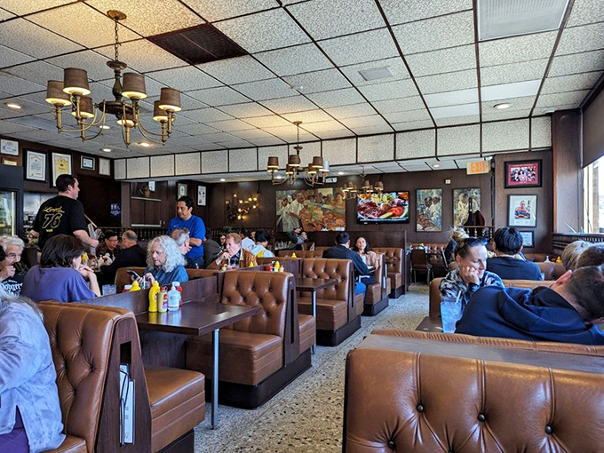 A bustling dining room where strangers become temporary neighbors, united by their quest for pastrami perfection.