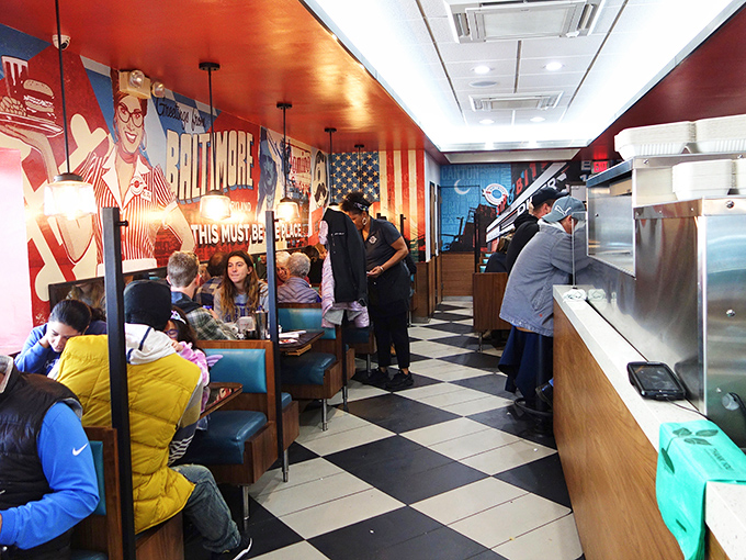 Where strangers become neighbors over shared appreciation of perfectly cooked eggs. The colorful mural reminds you this is Baltimore, hon.