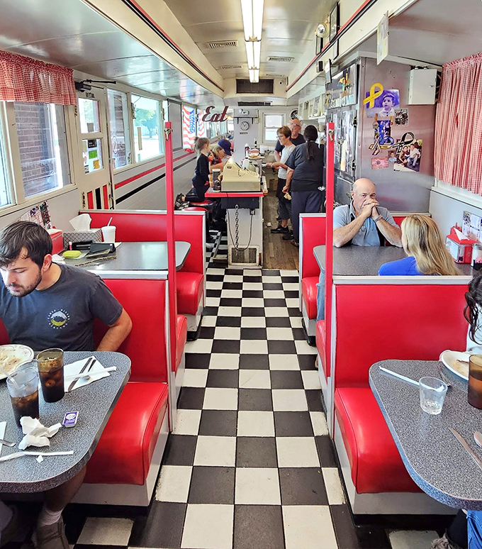 A bustling scene where conversations flow as freely as the coffee, creating that magical diner symphony of clattering plates and morning chatter.