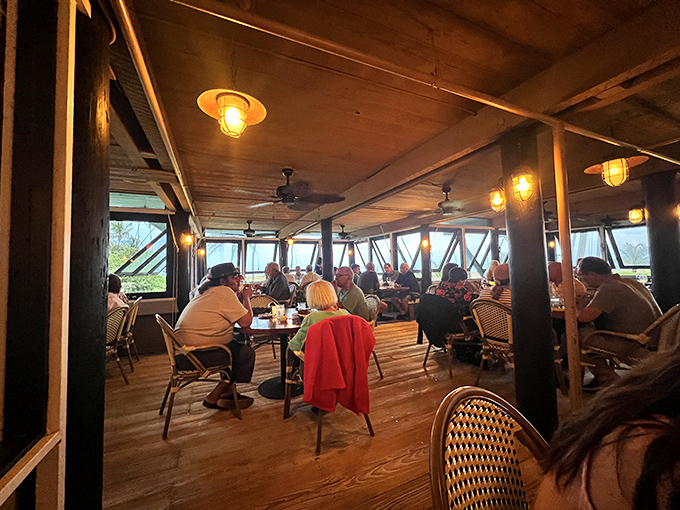 Evening at Sea Watch transforms the dining room into a warm sanctuary where conversations flow as smoothly as the wine.