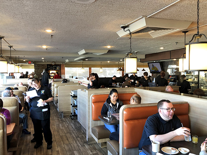 The bustling dining room where servers navigate the floor like skilled dancers in a well-choreographed ballet of breakfast service.