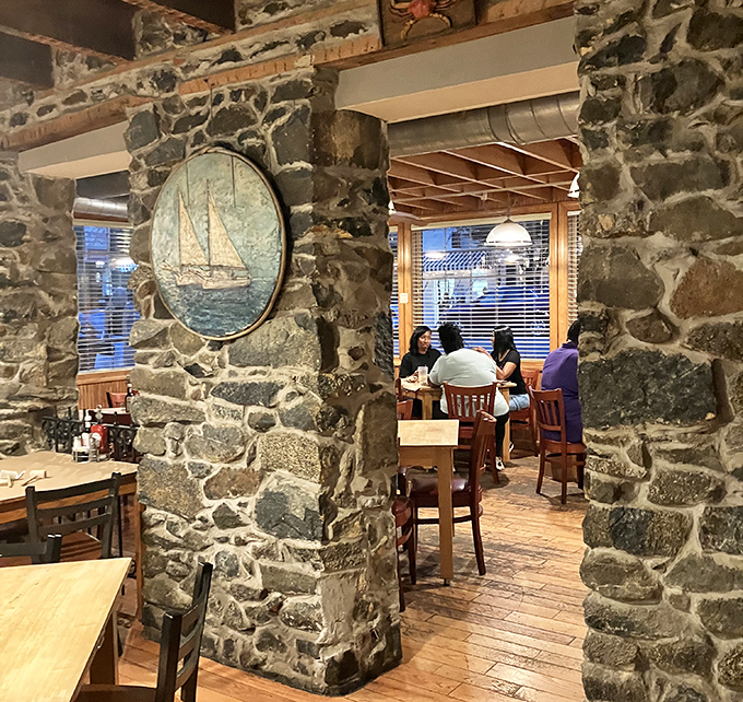 The dining room where stone walls tell stories of meals past. That sailboat painting isn't just decoration &ndash; it's a promise of the journey ahead.