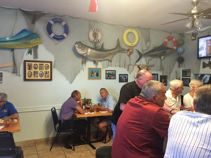 Where locals gather to share stories and seafood. The mounted fish silently approve of your menu choices from their place of honor.