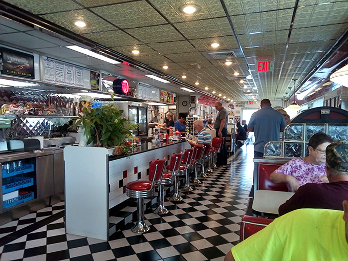 Where strangers become neighbors over coffee. The bustling counter and packed booths showcase the diner's status as Waverly's unofficial town hall.