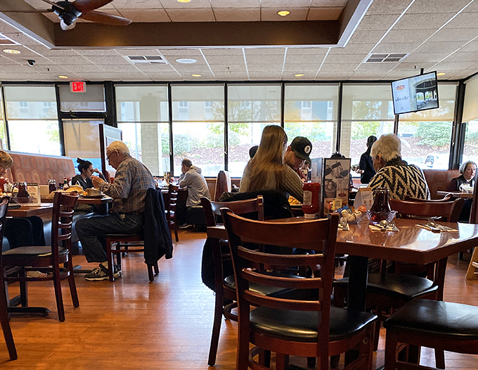 Where strangers become neighbors over coffee refills and shared maple syrup. The true Greenville experience happens between these wooden chairs.
