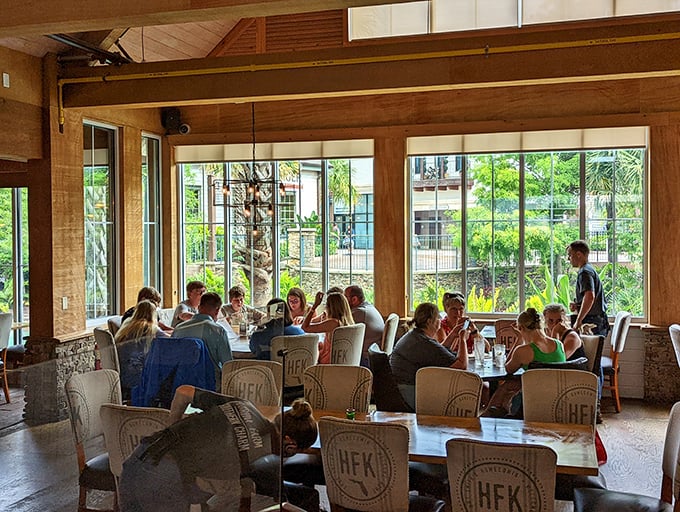 Sunlight streams through floor-to-ceiling windows, turning an ordinary lunch into a gathering that feels like Sunday dinner at your favorite relative's house.