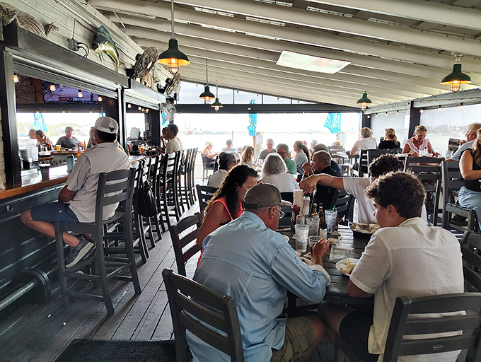 Where locals and visitors unite in the universal language of "pass the hot sauce." The waterfront views are complimentary with every conversation.