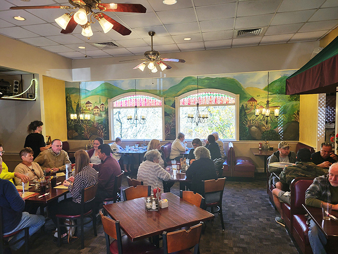 Locals fill the tables like they're in on a delicious secret, gathering under ceiling fans that lazily spin above conversations and clinking glasses.