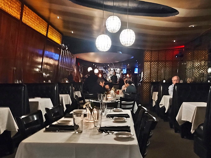 The dining room's soft lighting and mid-century charm transform ordinary Tuesday dinners into special occasions worth remembering.