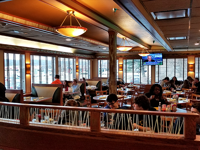 Where strangers become neighbors over pancakes. The bustling dining room hums with the symphony of forks meeting plates.