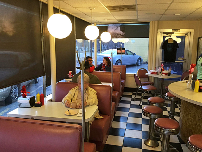 Fellow pilgrims on the path to burger enlightenment, enjoying a meal that connects them to generations of Kansans who sat in these same booths.