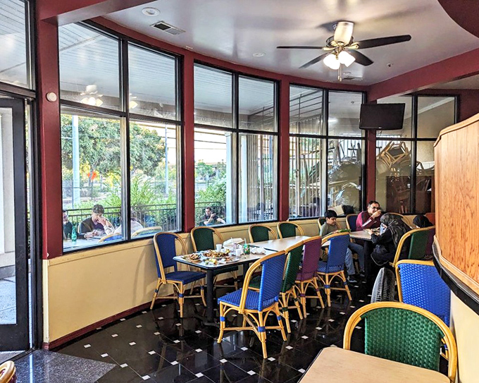 Where food brings people together. In this sunny corner, strangers become friends over plates of shared deliciousness.