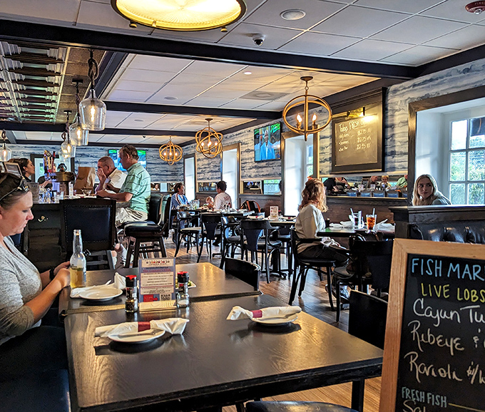 The buzz of satisfied diners fills this nautically-themed dining room, where seafood stories are shared and chowder memories are made under golden pendant lights.
