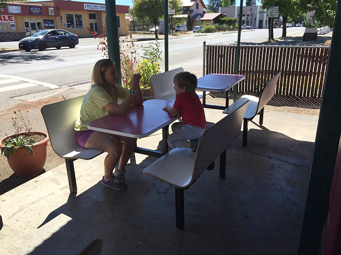 Generations of burger lovers have occupied these tables, proving that good food creates the kind of family memories that no theme park can match.
