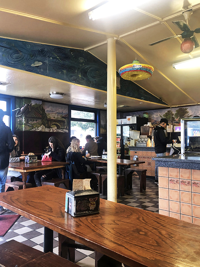 Lunchtime at El Buen Sabor&mdash;where strangers become temporary family, united by the universal language of great food.
