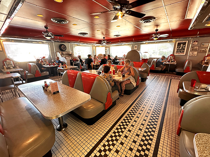 Where strangers become friends over coffee refills. The bustling dining room hums with the sound of forks meeting plates and stories being shared.