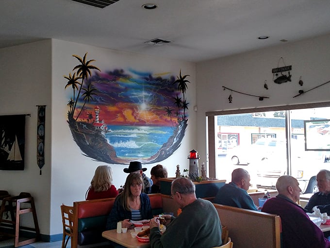The vibrant coastal mural transports diners to oceanside bliss. Who needs a water view when you've got art that practically splashes?