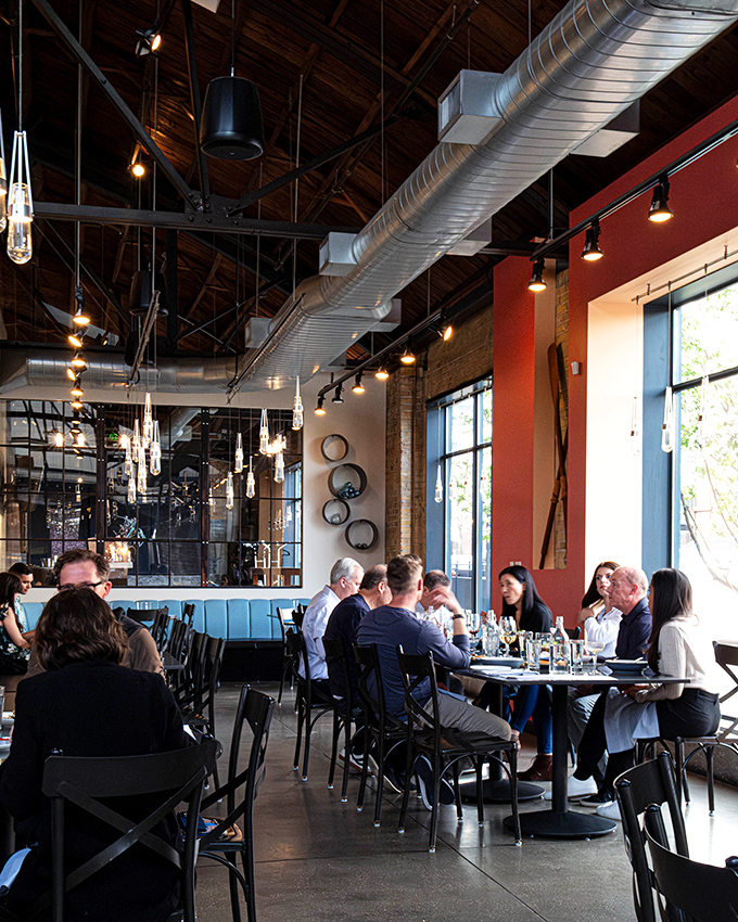 The dining room buzzes with the universal language of good food. Notice how nobody's looking at their phones? That's the power of proper seafood.