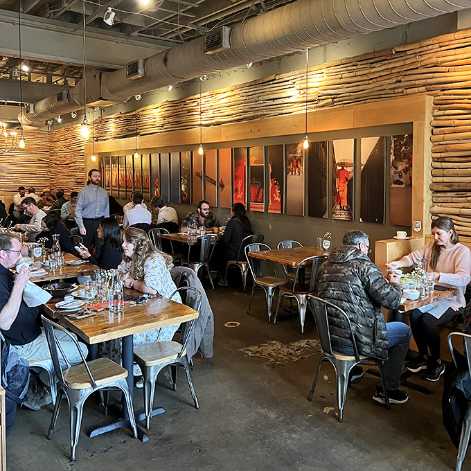A bustling dinner service where strangers become temporary neighbors, united by the universal language of "mmm" and "you have to try this."