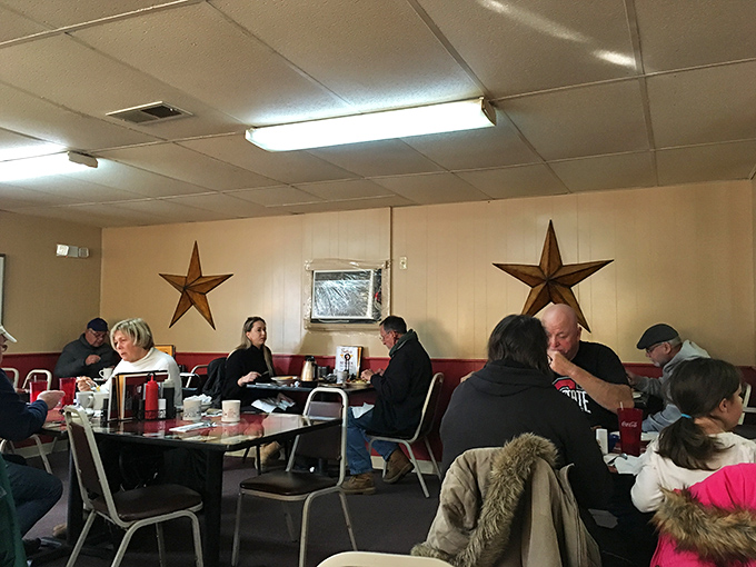 Rustic barn stars adorn walls where strangers become neighbors over plates of eggs and shared maple syrup. No phones necessary for this social network.