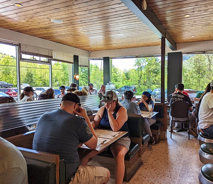 The universal language of menu contemplation&mdash;where hikers, weekenders, and locals unite in the sacred ritual of deciding what to eat.