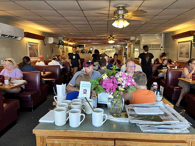 Where locals and tourists achieve peaceful coexistence over plates of pancakes and endless coffee in the ultimate beach town democracy.