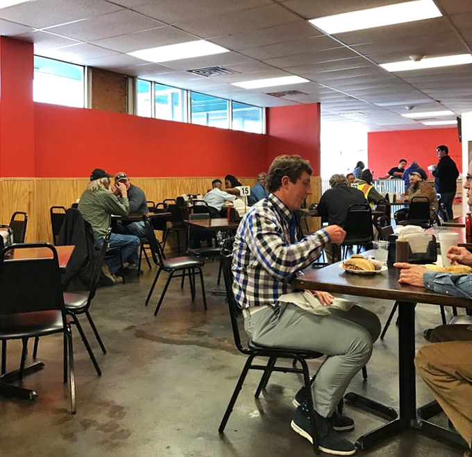 Where strangers become friends over shared BBQ appreciation. That checkered shirt guy is having what can only be described as a moment.