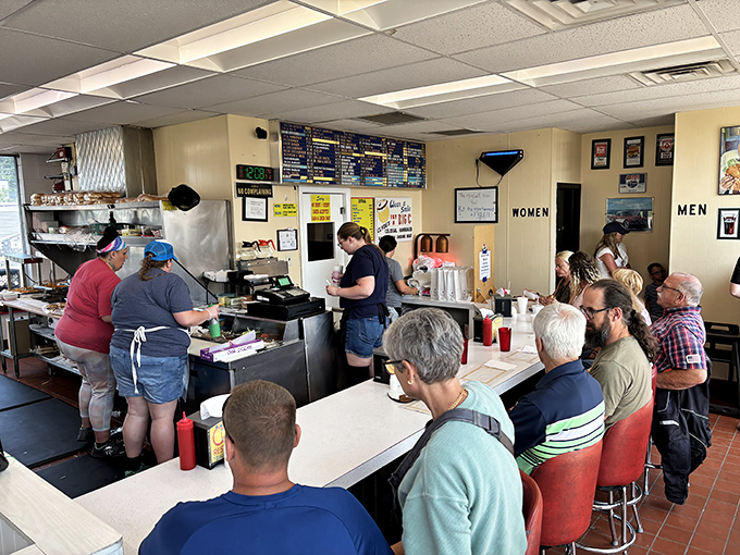 The lunch rush at Clyde's&mdash;where strangers become temporary neighbors united by the universal language of "pass the ketchup, please."