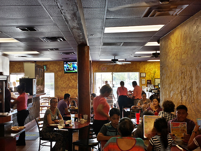 A bustling dining room where conversations flow as freely as the salsa. Every filled table tells its own delicious story.