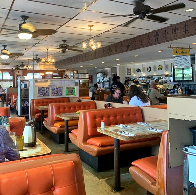 Locals filling booths at all hours because when you've found your spot, you stick with it through thick and thin.