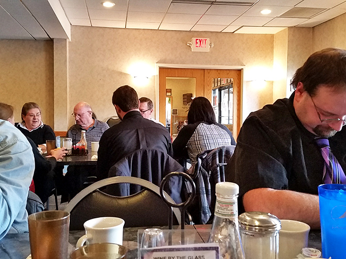 Regular patrons gather like a well-rehearsed ensemble, each playing their part in the daily ritual of community and conversation.