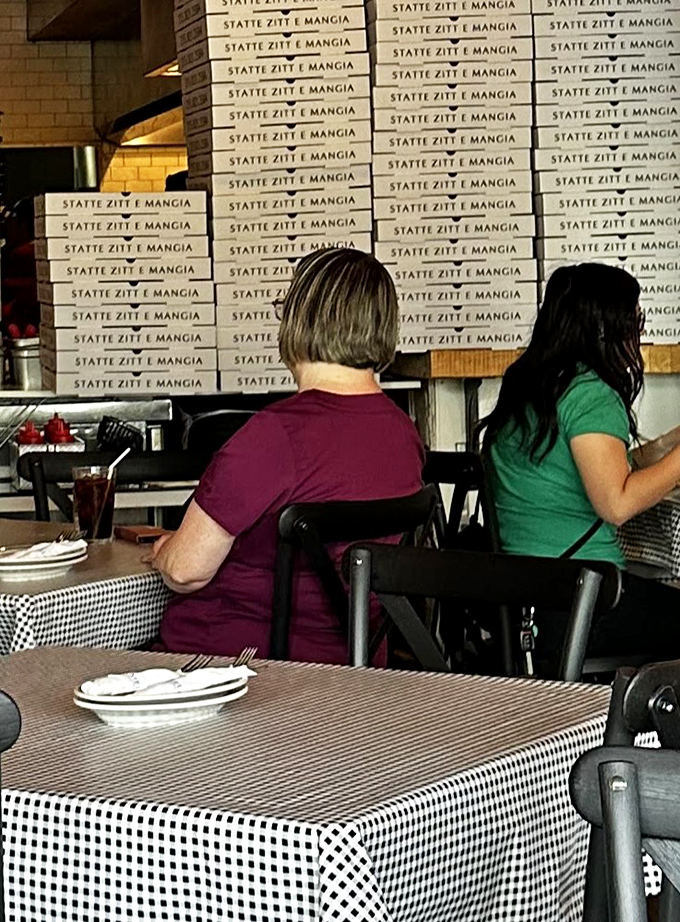 Behind every great Italian restaurant is a wall of pizza boxes and patrons who know they've made excellent life choices.