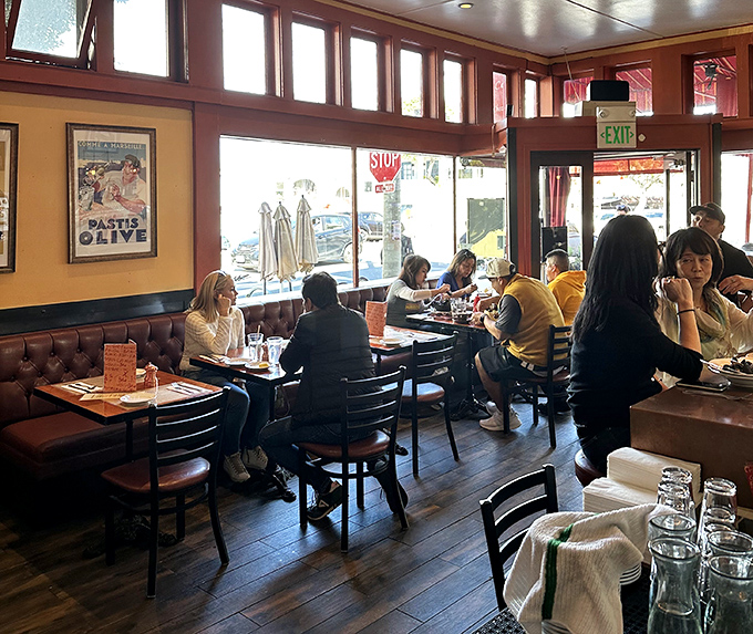 Where strangers become friends over shared butter and bread. The dining room hums with the universal language of "mmm" and "you have to try this."