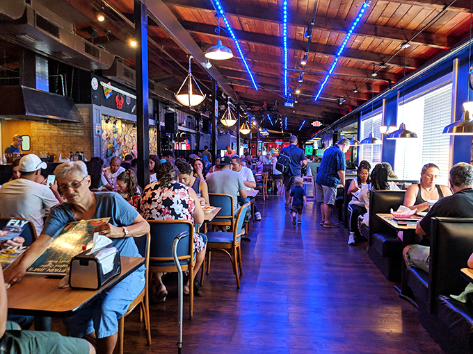 A bustling dining room where strangers become united in the universal language of "please pass the crab leg crackers."