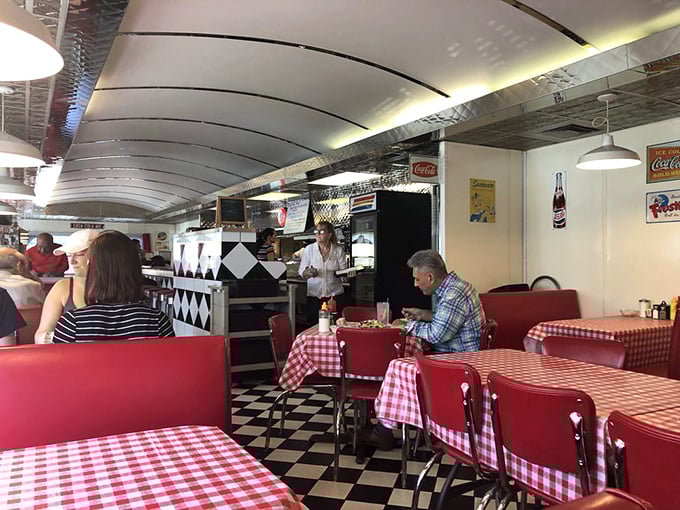 Where strangers become neighbors over pie and coffee. Those red-checkered tablecloths have absorbed more local wisdom than any town hall meeting.